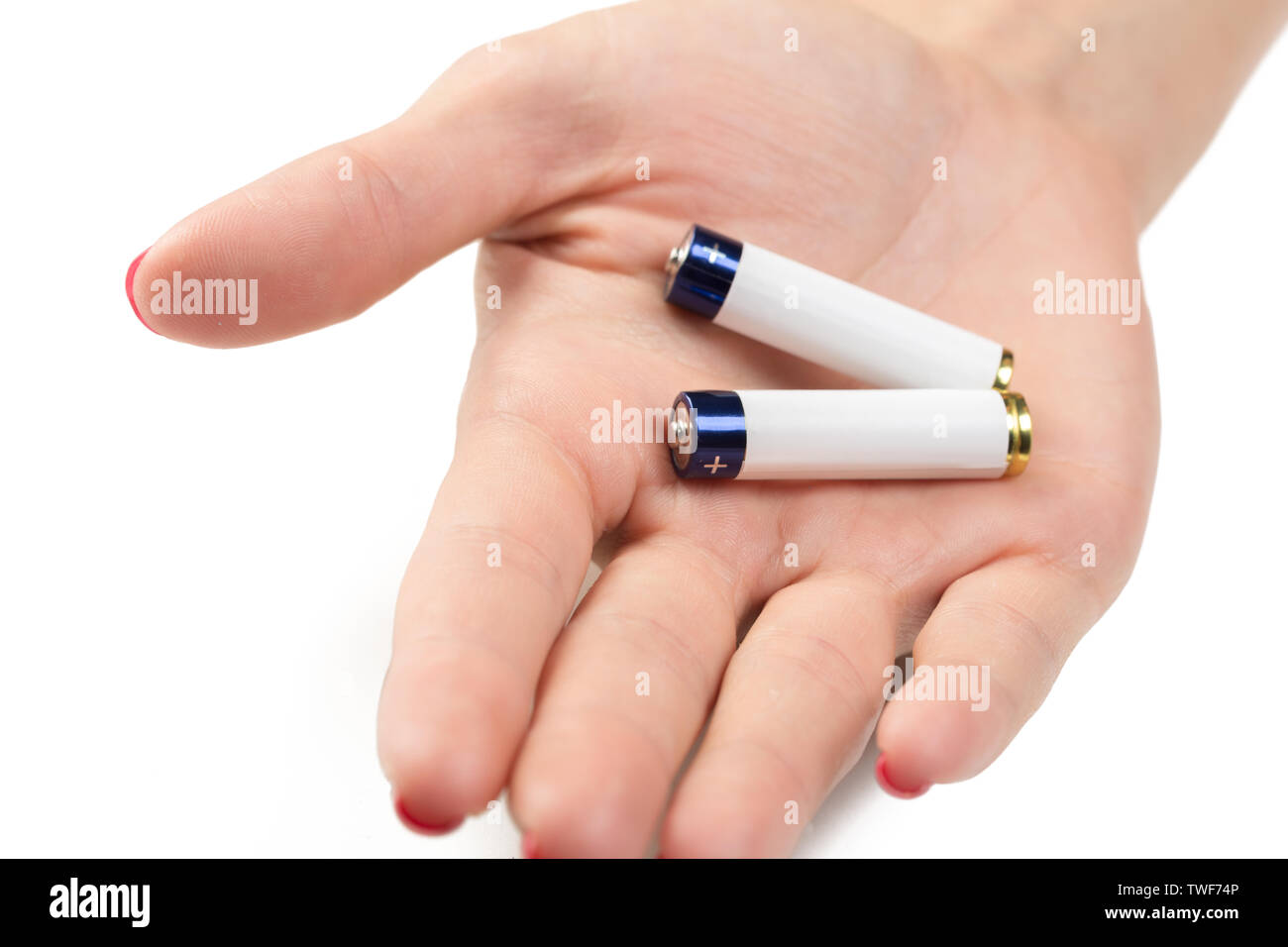 Batteries in hand Stock Photo - Alamy