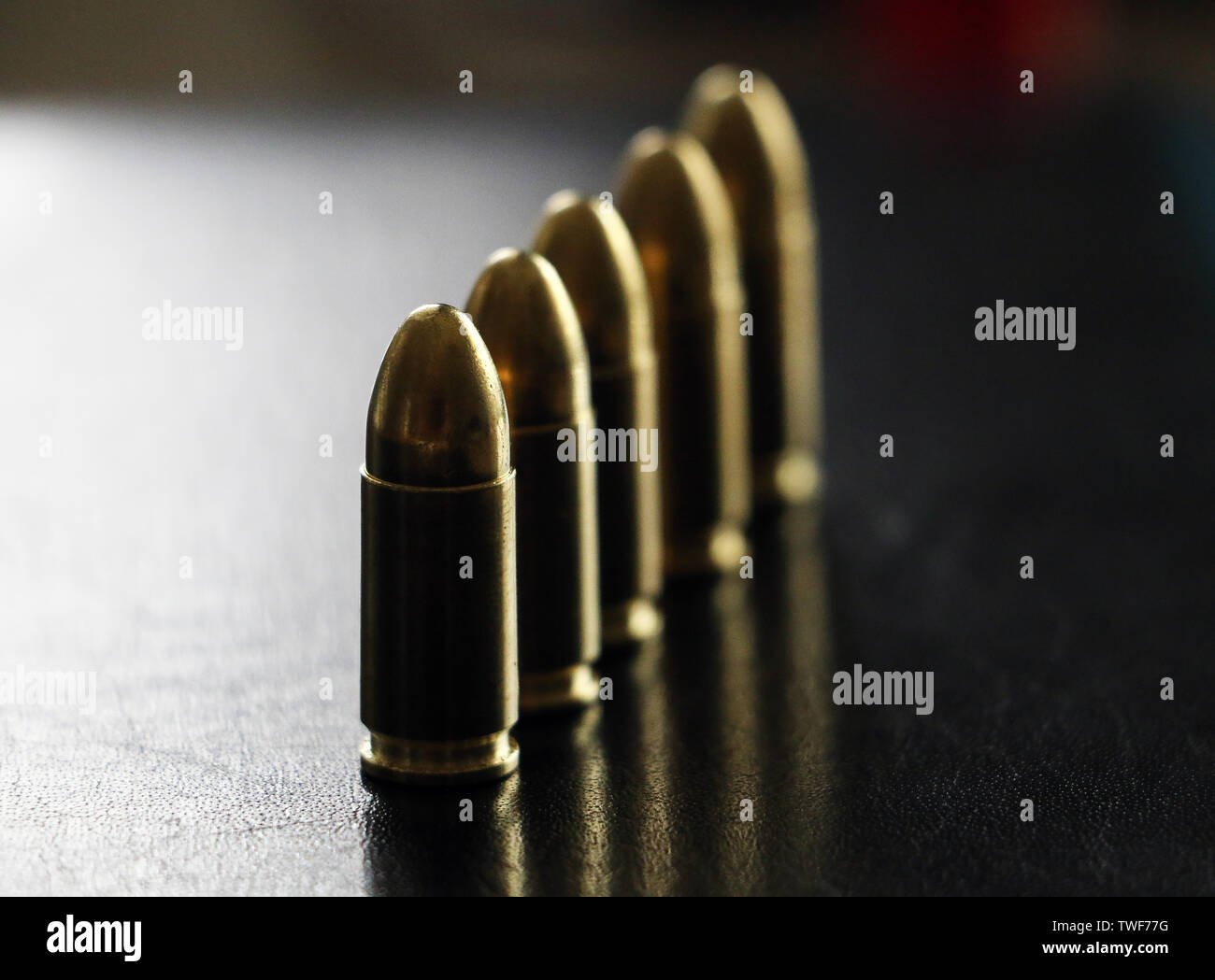 Close up of 9 mm golden pistol bullets ammo on background. Special ...