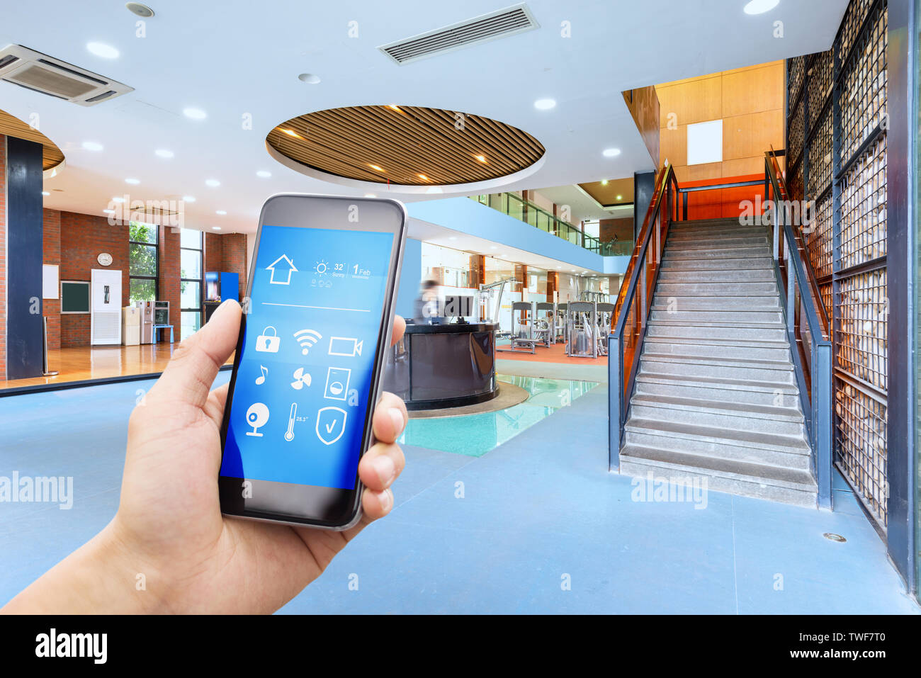 smart phone with smart home with modern lobby Stock Photo - Alamy