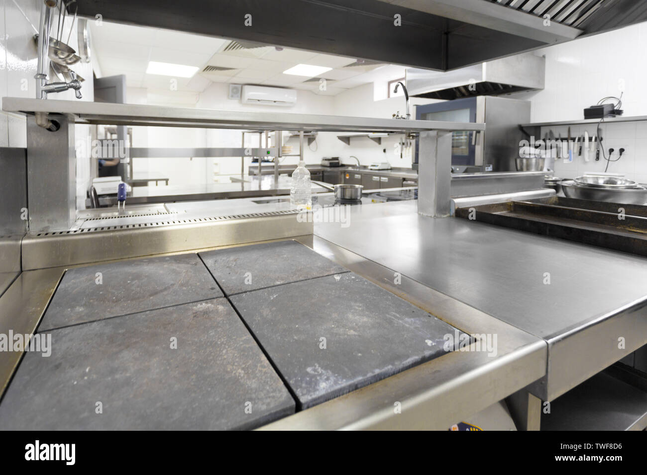 Metal dishes in a restaurant kitchen Stock Photo - Alamy