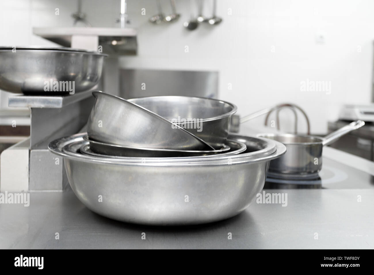 Metal dishes in a restaurant kitchen Stock Photo - Alamy
