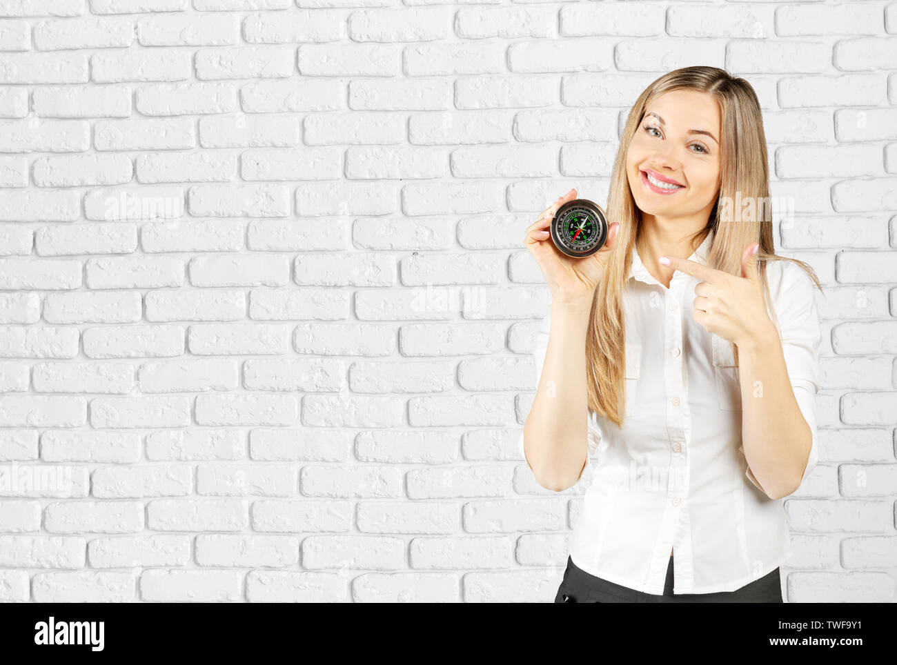 Caucasian Woman Holding Compass Isolated Stock Photo - Alamy