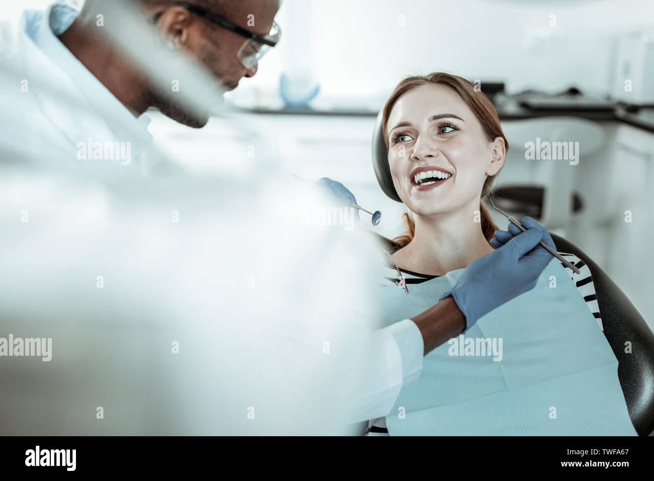 Carrying meatal tools. Laughing attractive lady having positive ...