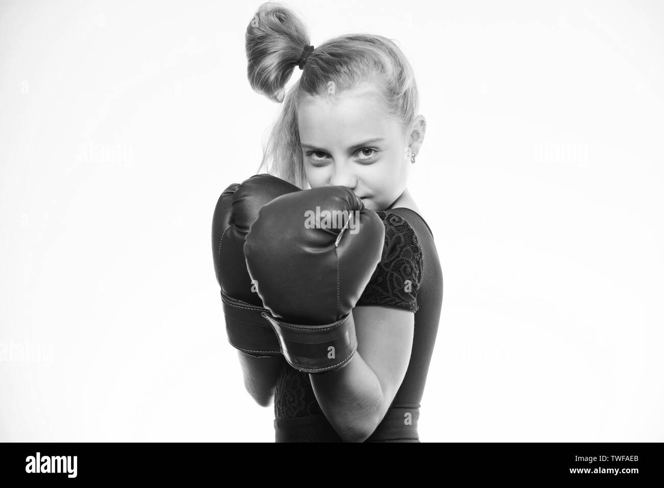 Girl child with blue gloves posing on white background. Sport ...