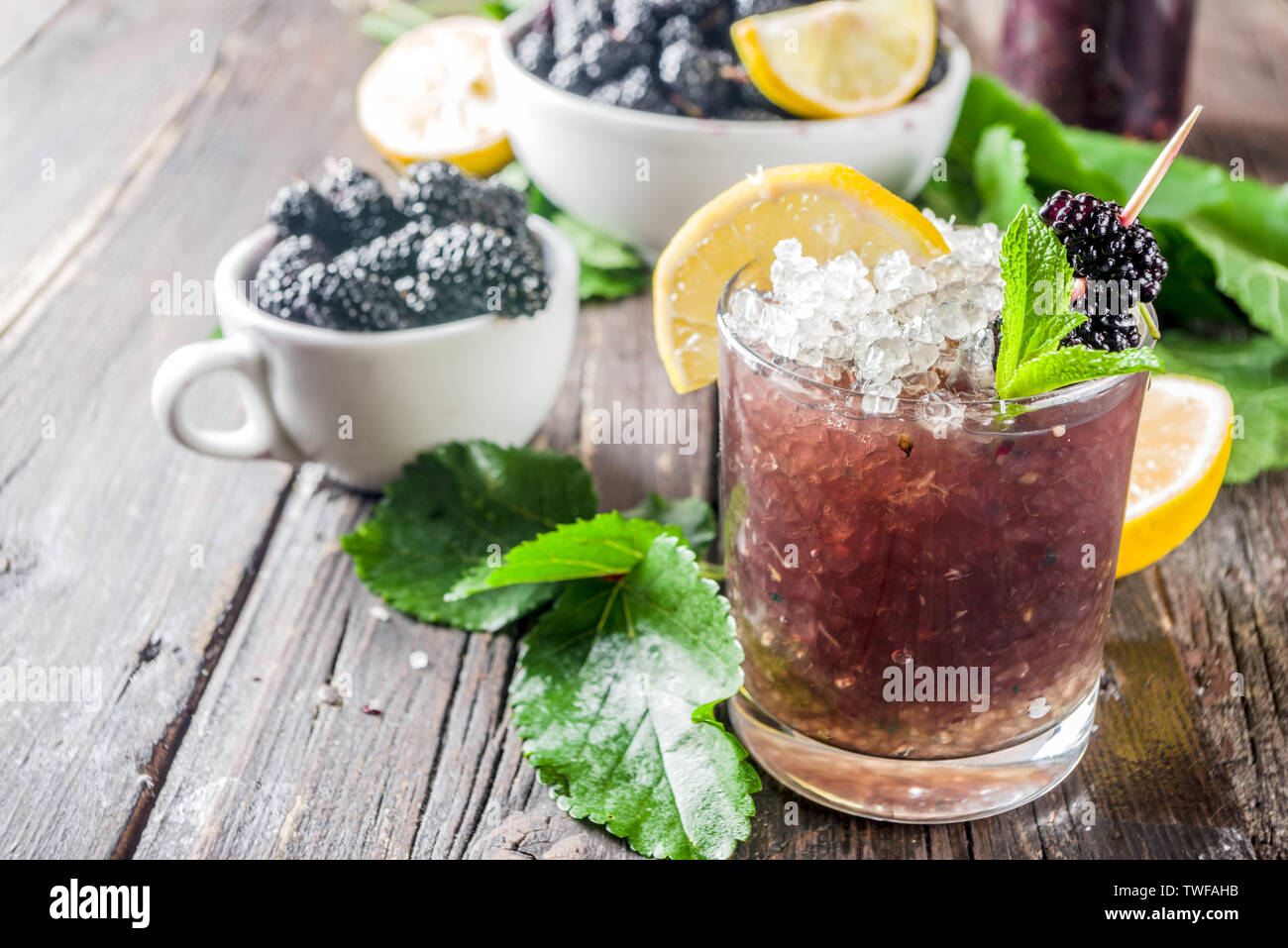 Homemade iced mulberry lemonade or mojito cocktail, with fresh ...