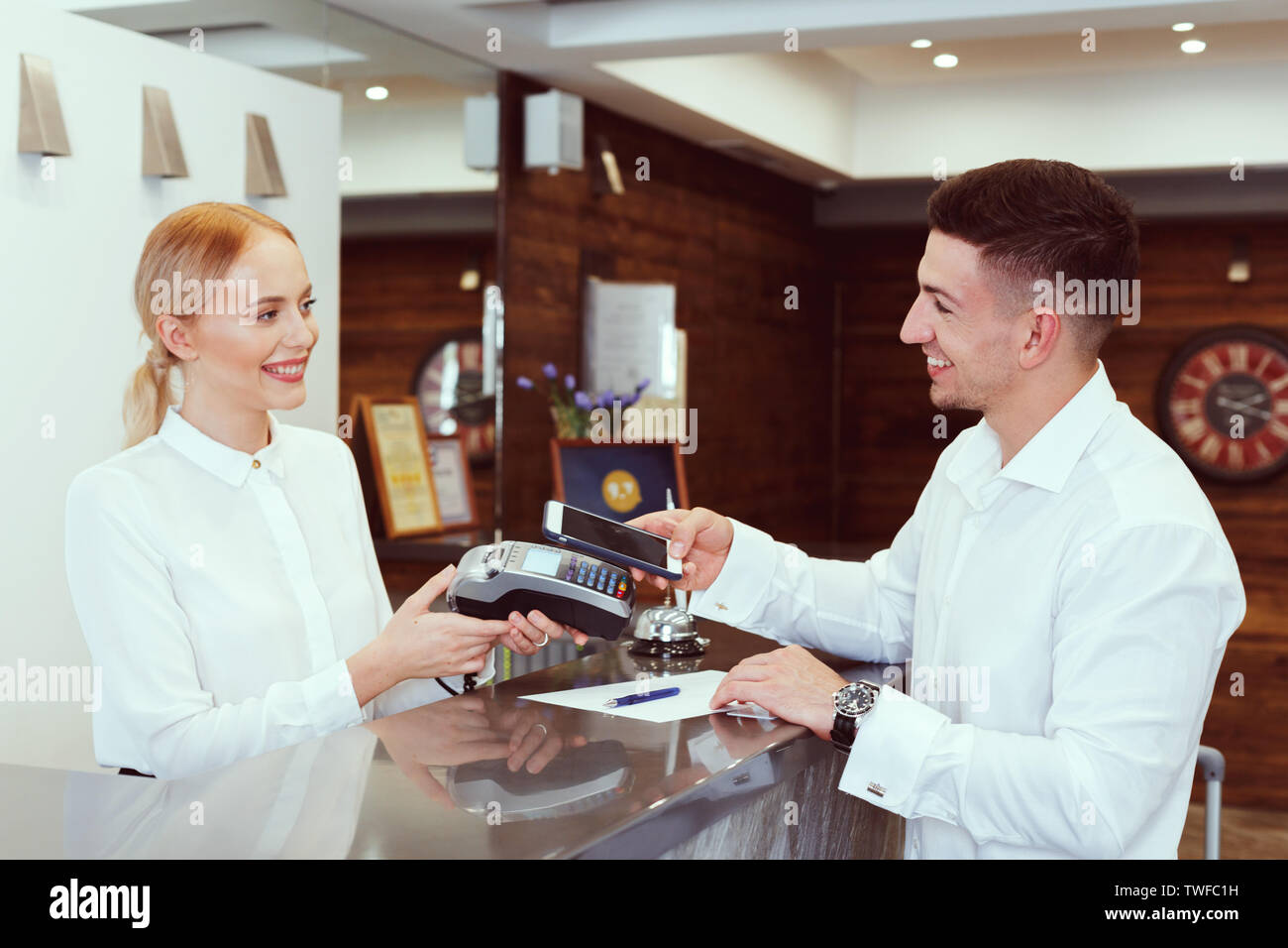 man at hotel reception Stock Photo - Alamy