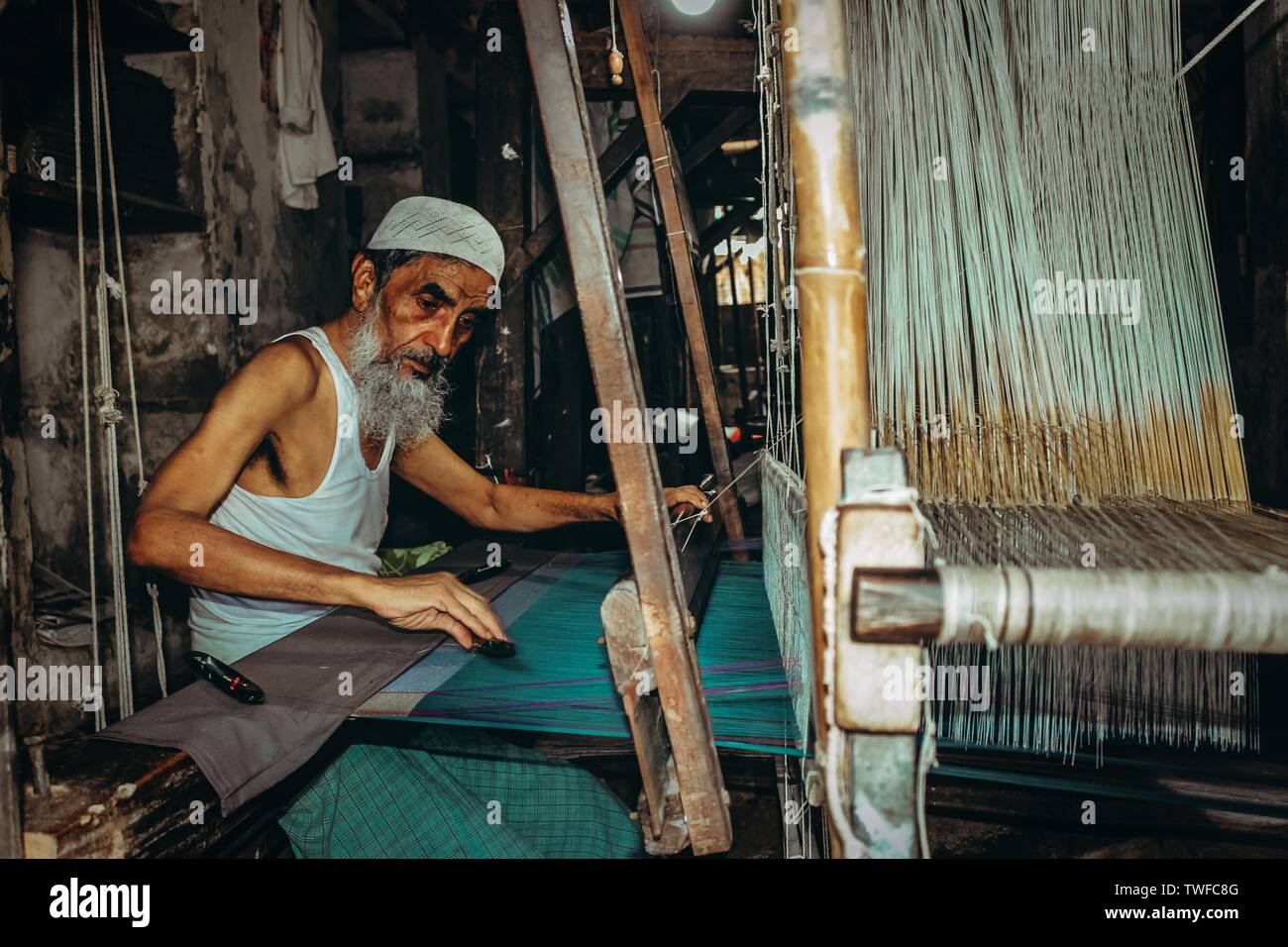 VARANASI, INDIA - Aug 12, 2018: Indian muslim making handmade clothes ...