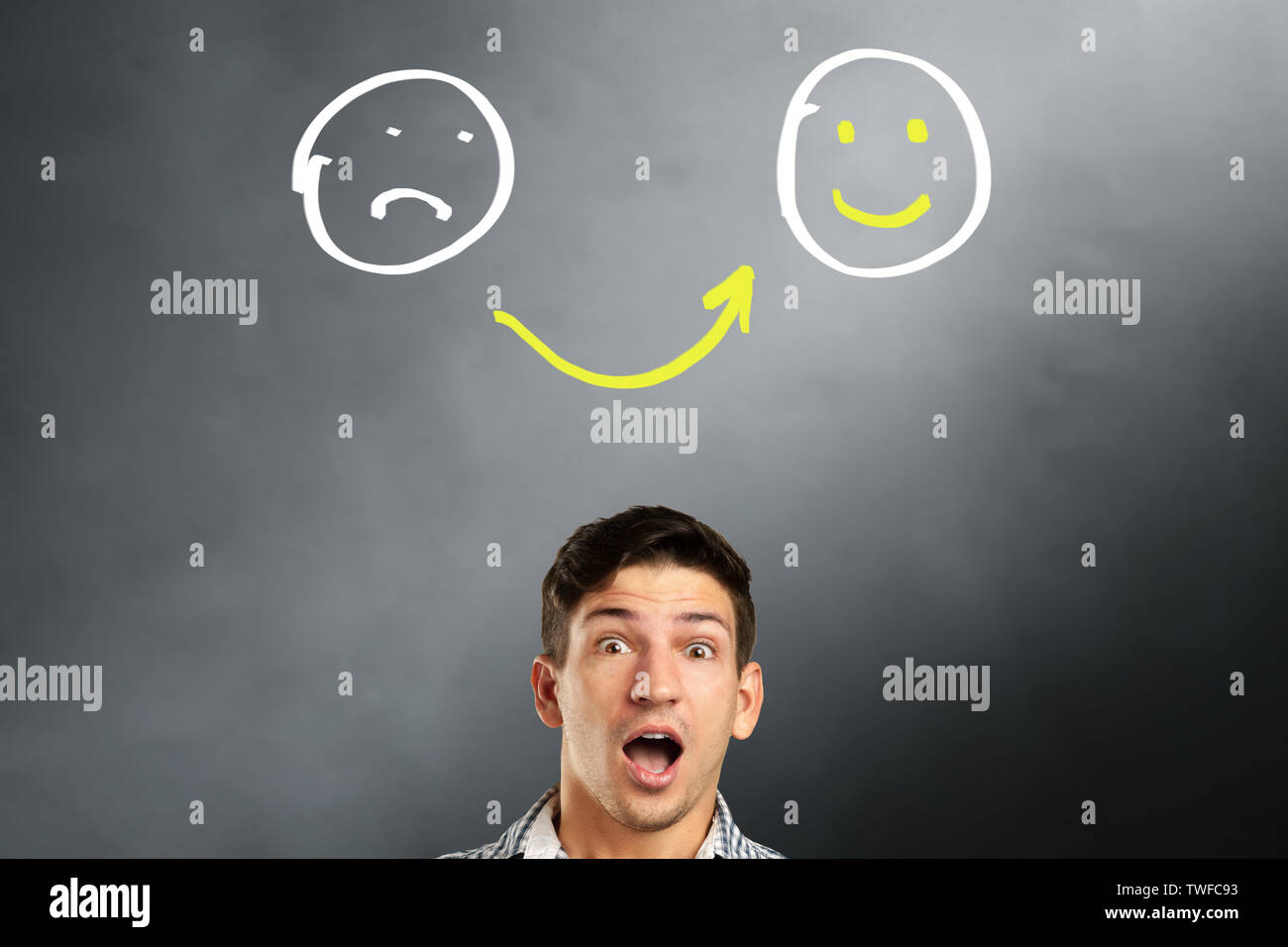 From sad to happy emoticons. Young man choosing emotion Stock Photo - Alamy