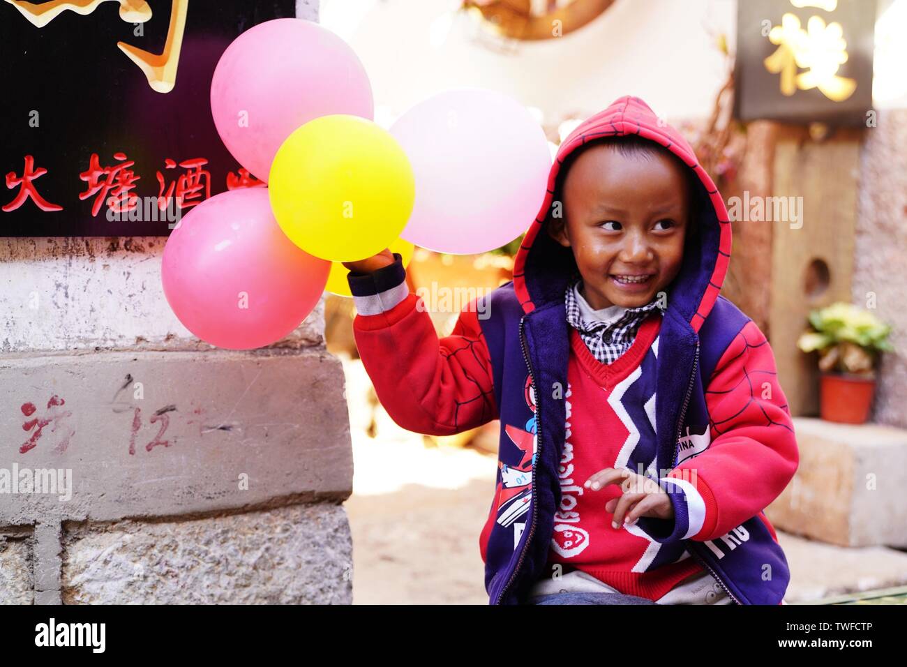 Little Naxi boy Stock Photo - Alamy