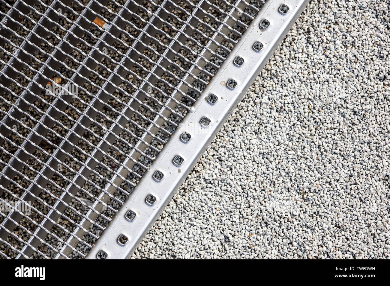 metal grid background on pavement on the street Stock Photo - Alamy