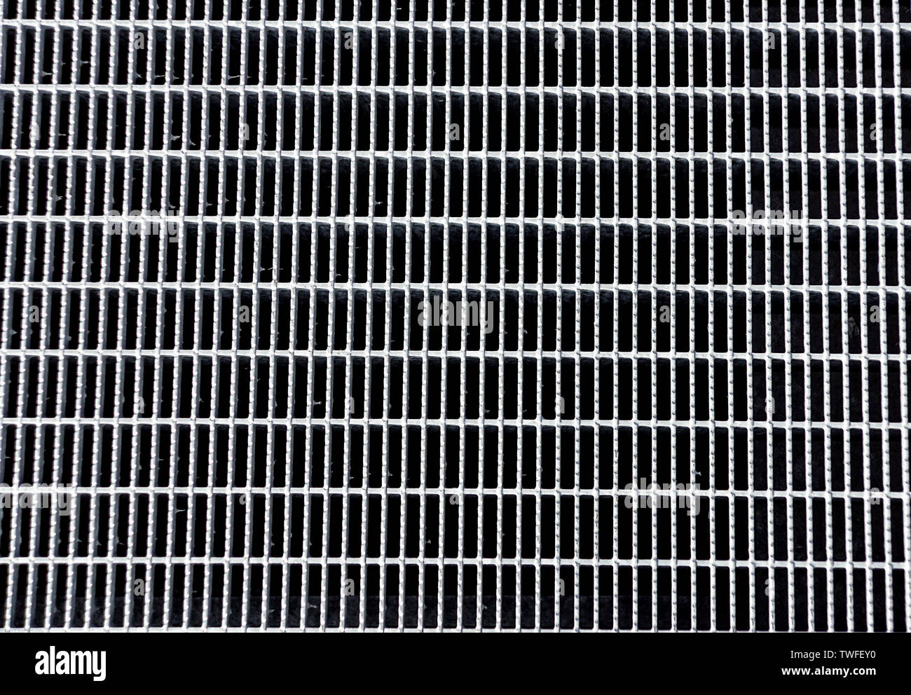 metal grid background on pavement on the street Stock Photo - Alamy