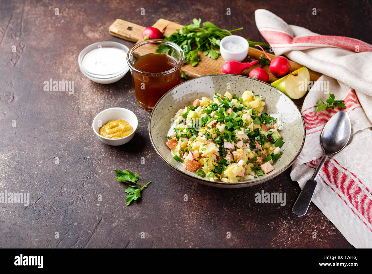 Cold Russian Soup Okroshka with sausage, vegetables and kvass in bowl ...