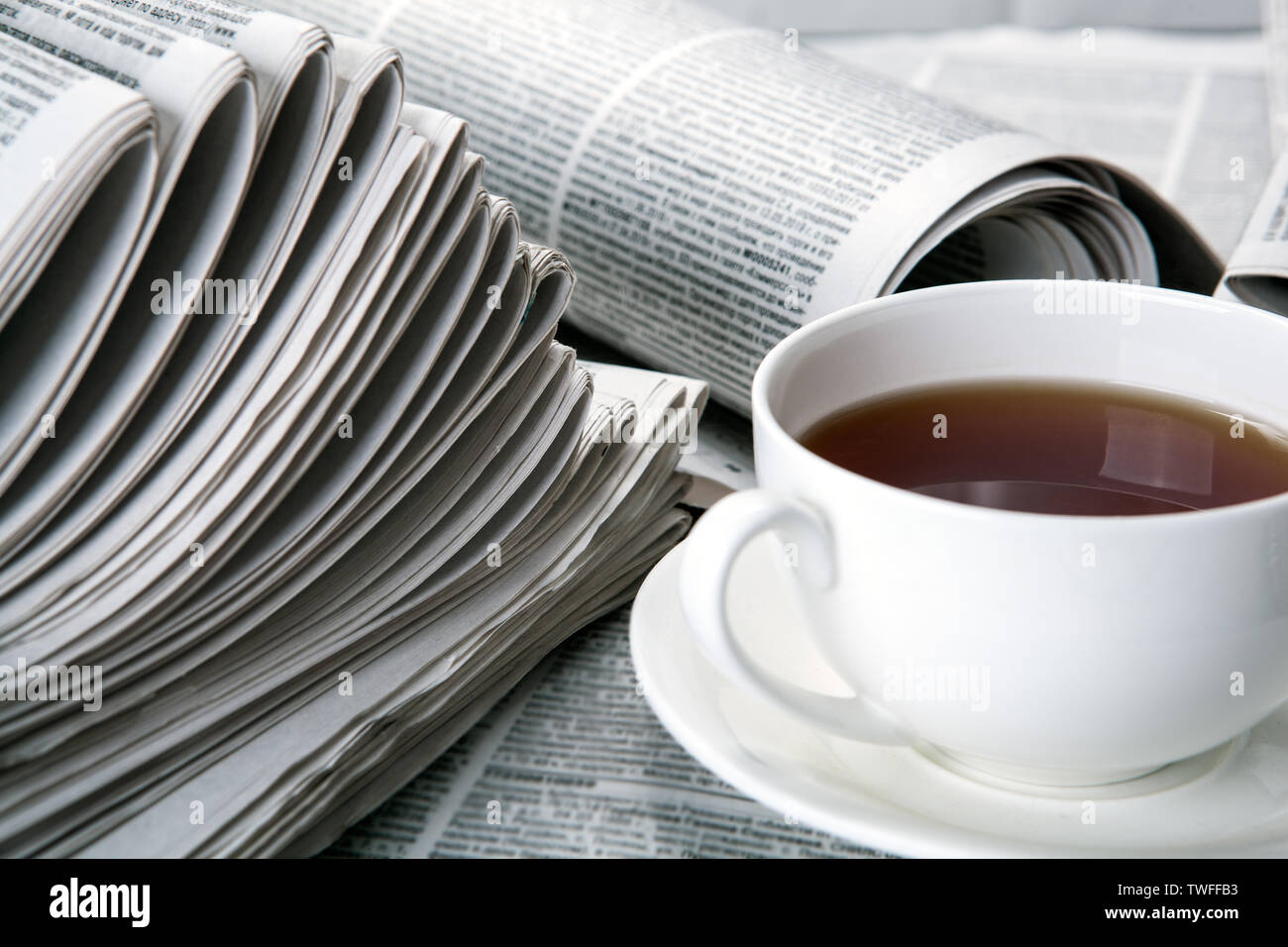 Stack newspapers on coffee table hi-res stock photography and images ...