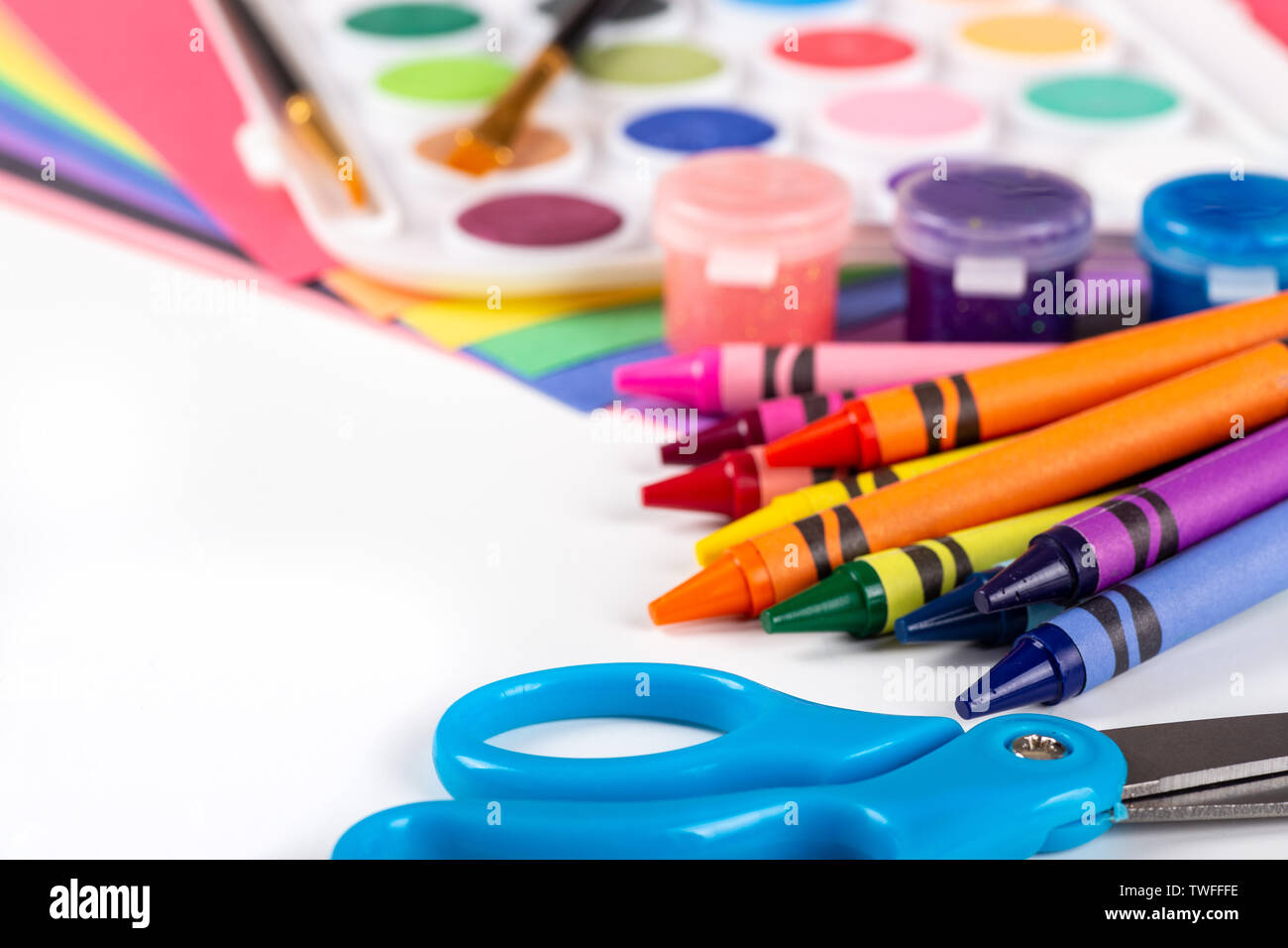 Closeup of coloring and painting school supplies on a white background ...
