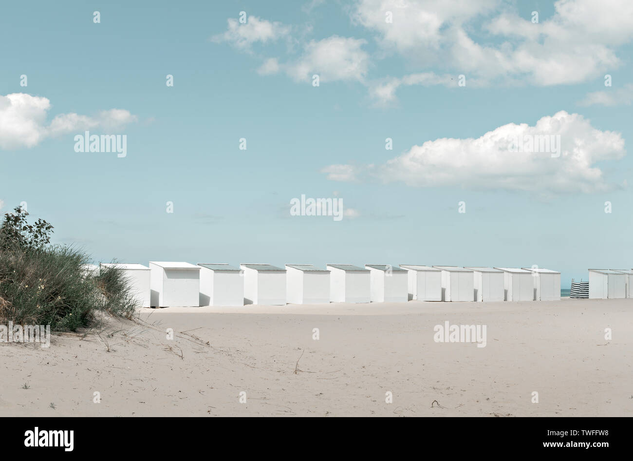 A row of white beach cabins on a summer day Stock Photo - Alamy