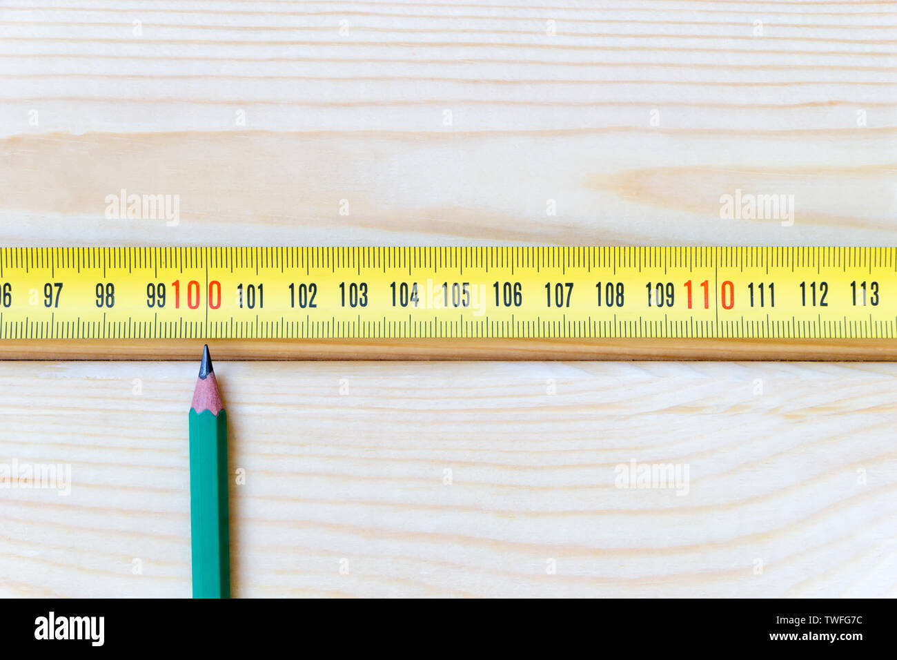 Measurement concept with copy space. A simple pencil points to the mark ...