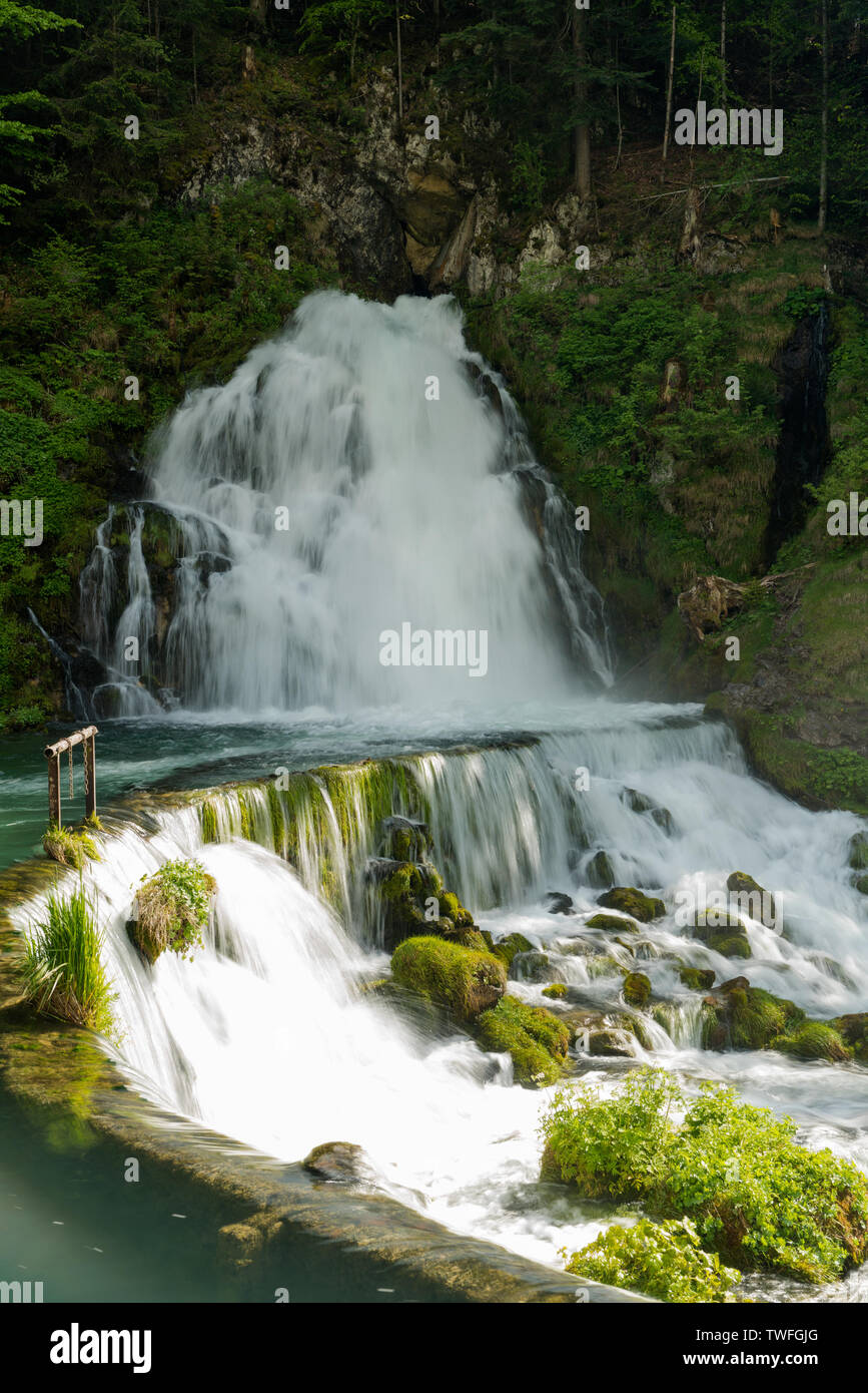 the idyllic and picturesque Jaunfall waterfall in the Swiss Alps in the ...