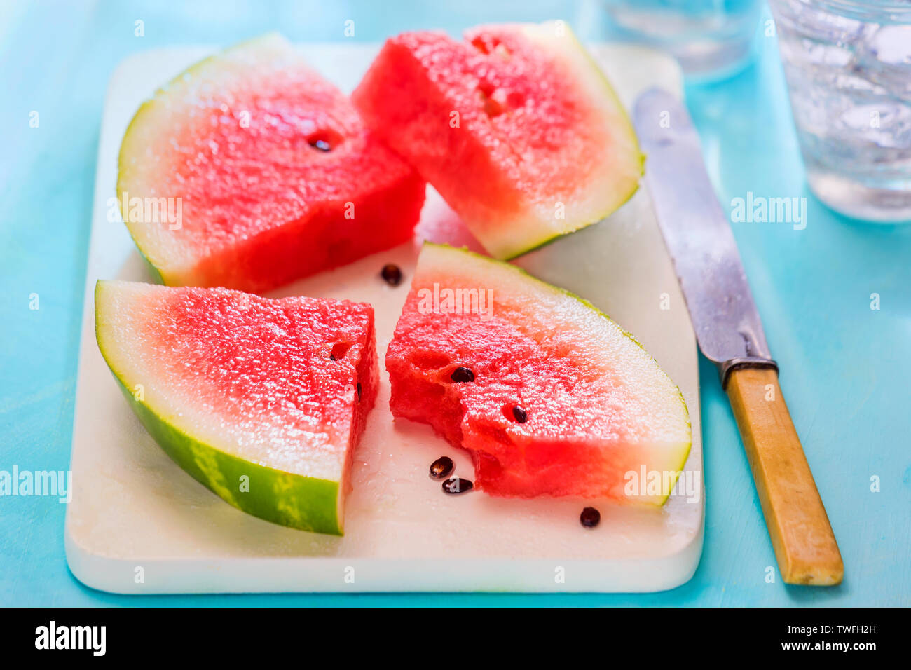 Watermelon chunks on wooden board Stock Photo - Alamy
