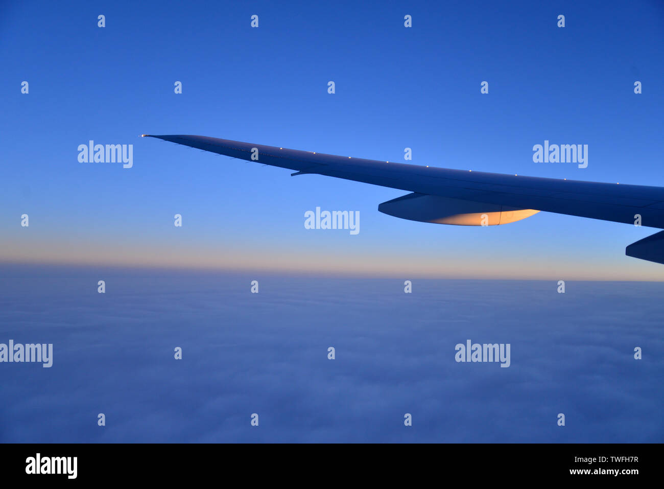 Air-flying wings and a sea of clouds Stock Photo - Alamy