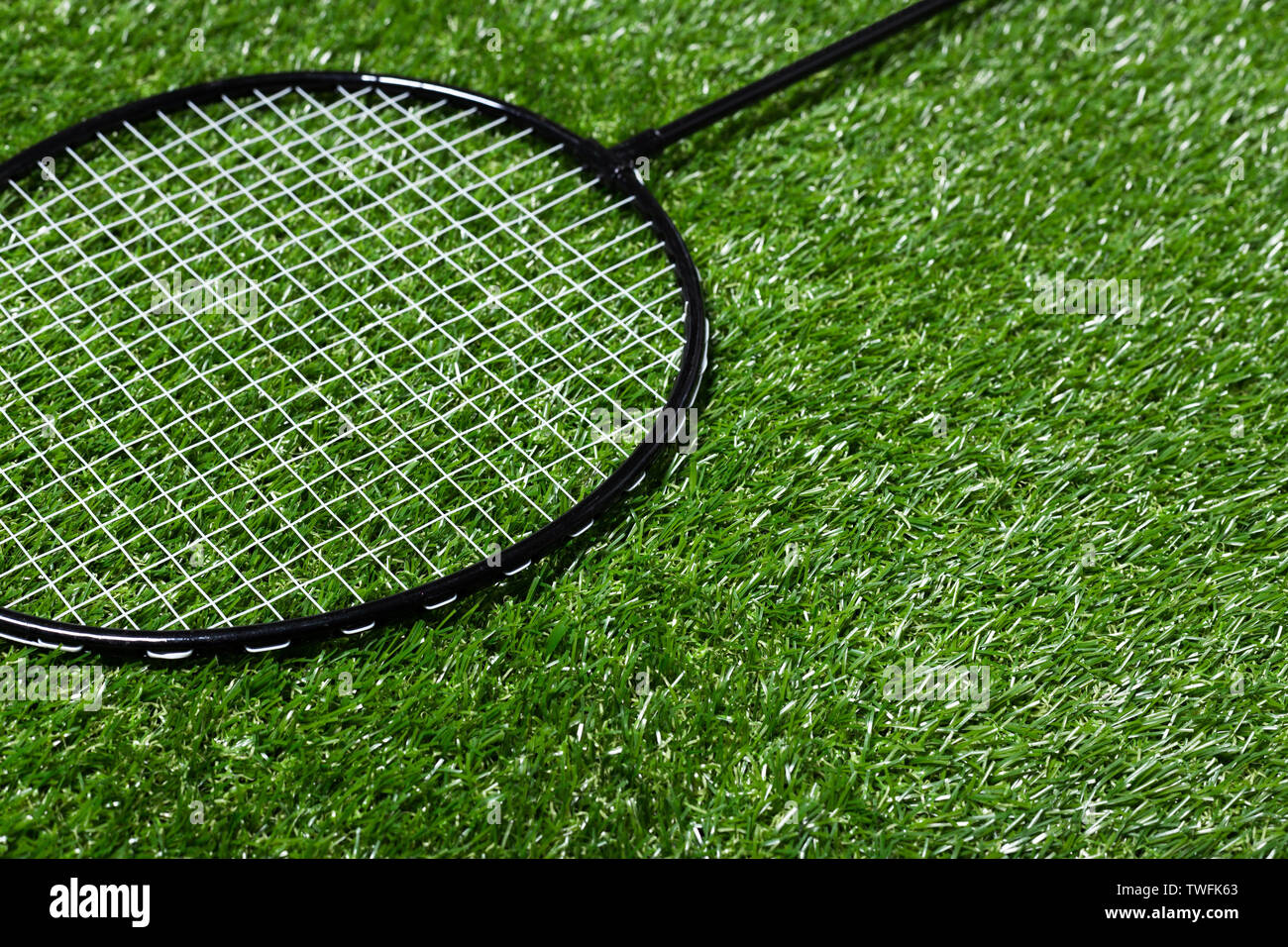 badminton racket on grass Stock Photo - Alamy