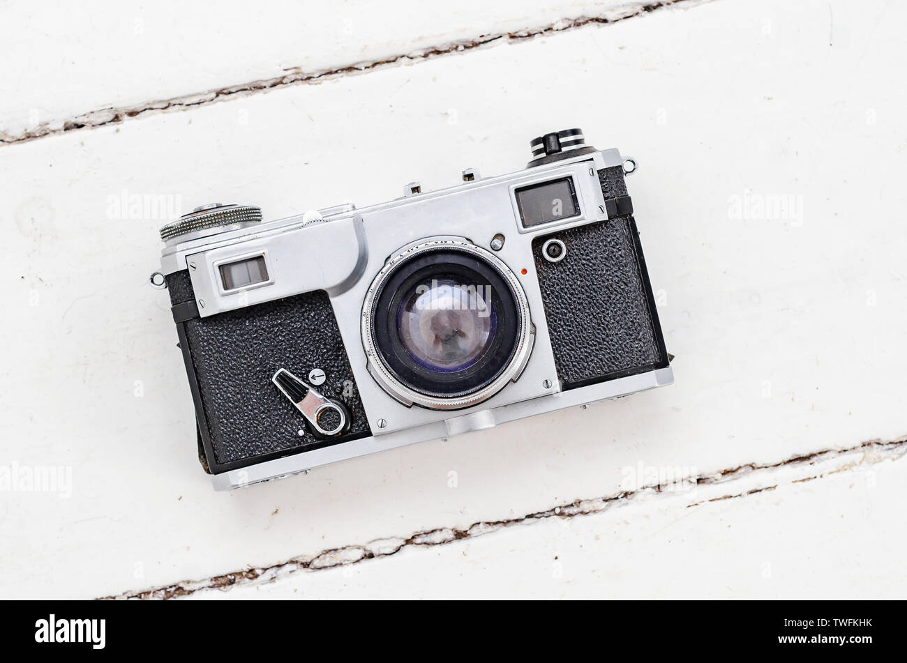 Old film camera on white boards. Vintage equipment Stock Photo - Alamy