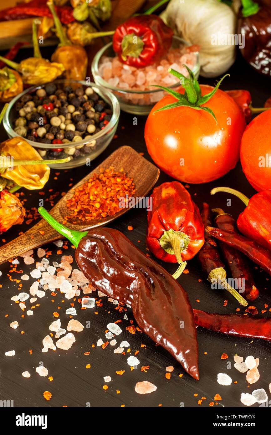 Homemade chili sauce. Spicy food. Chili peppers on black background ...