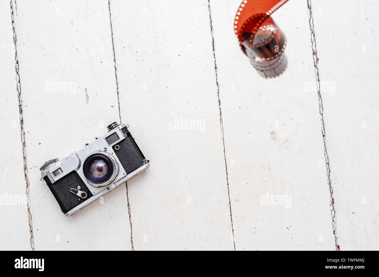 Vintage old camera with 35mm red film. Old equipment Stock Photo - Alamy