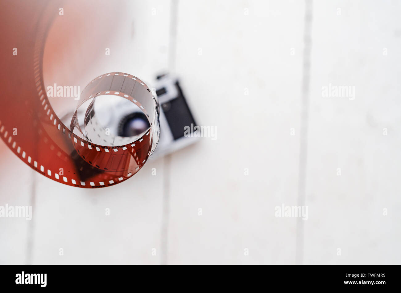 Vintage old camera with 35mm red film. Old equipment Stock Photo - Alamy