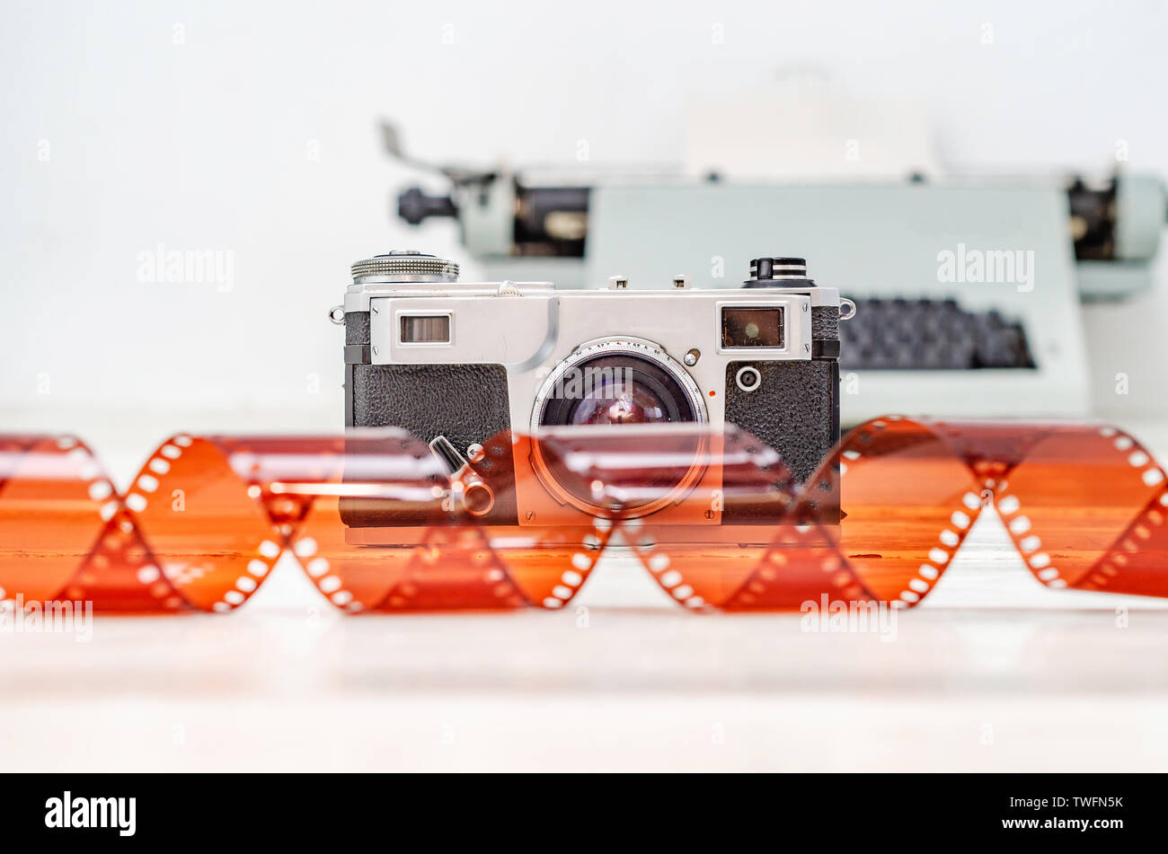 Vintage old camera with 35mm red film. Old equipment Stock Photo - Alamy