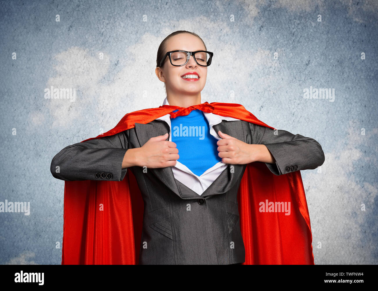 Portrait of business woman super heroine tearing off her shirt. Smiling ...
