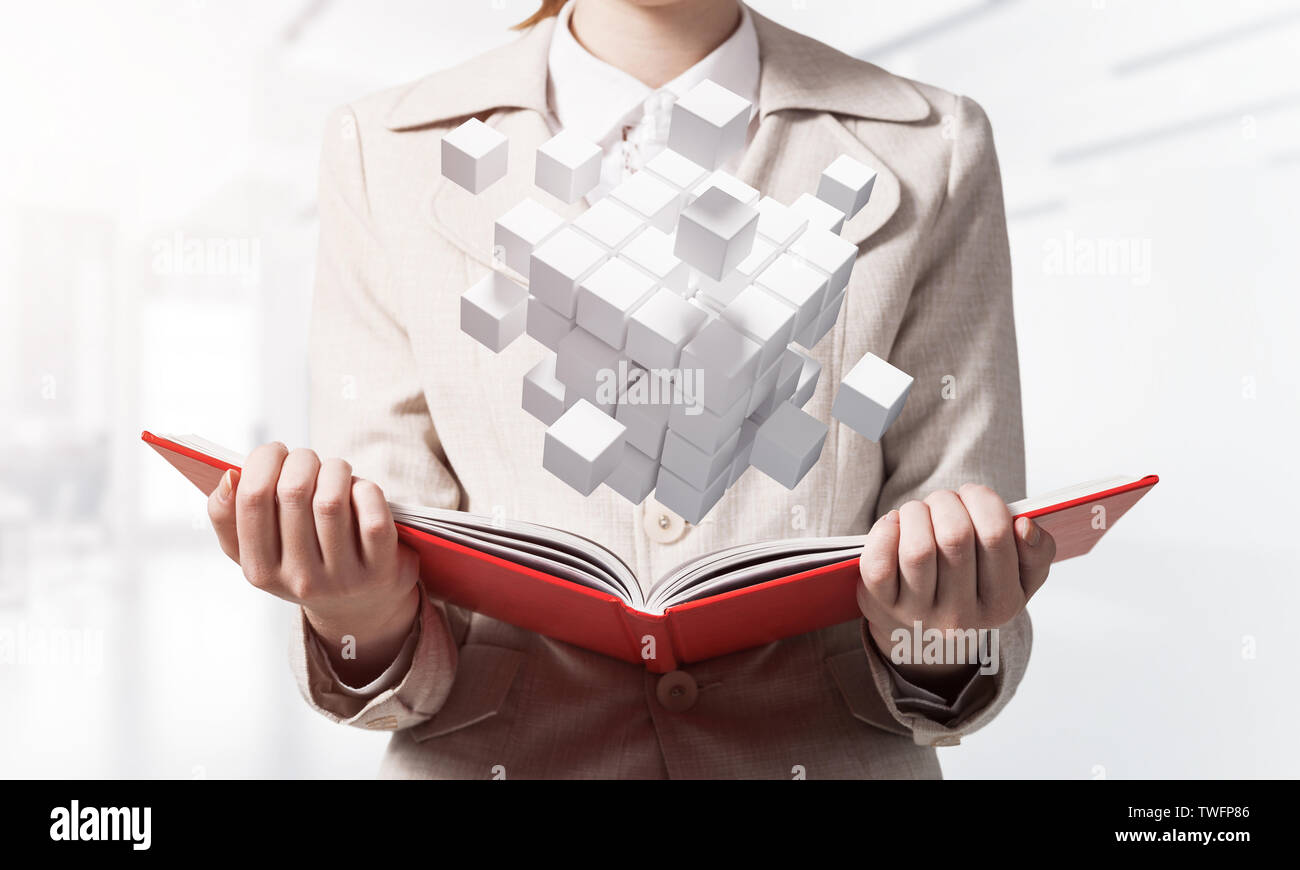 Young woman holding open book with flying 3d white cubes. Hi-tech ...