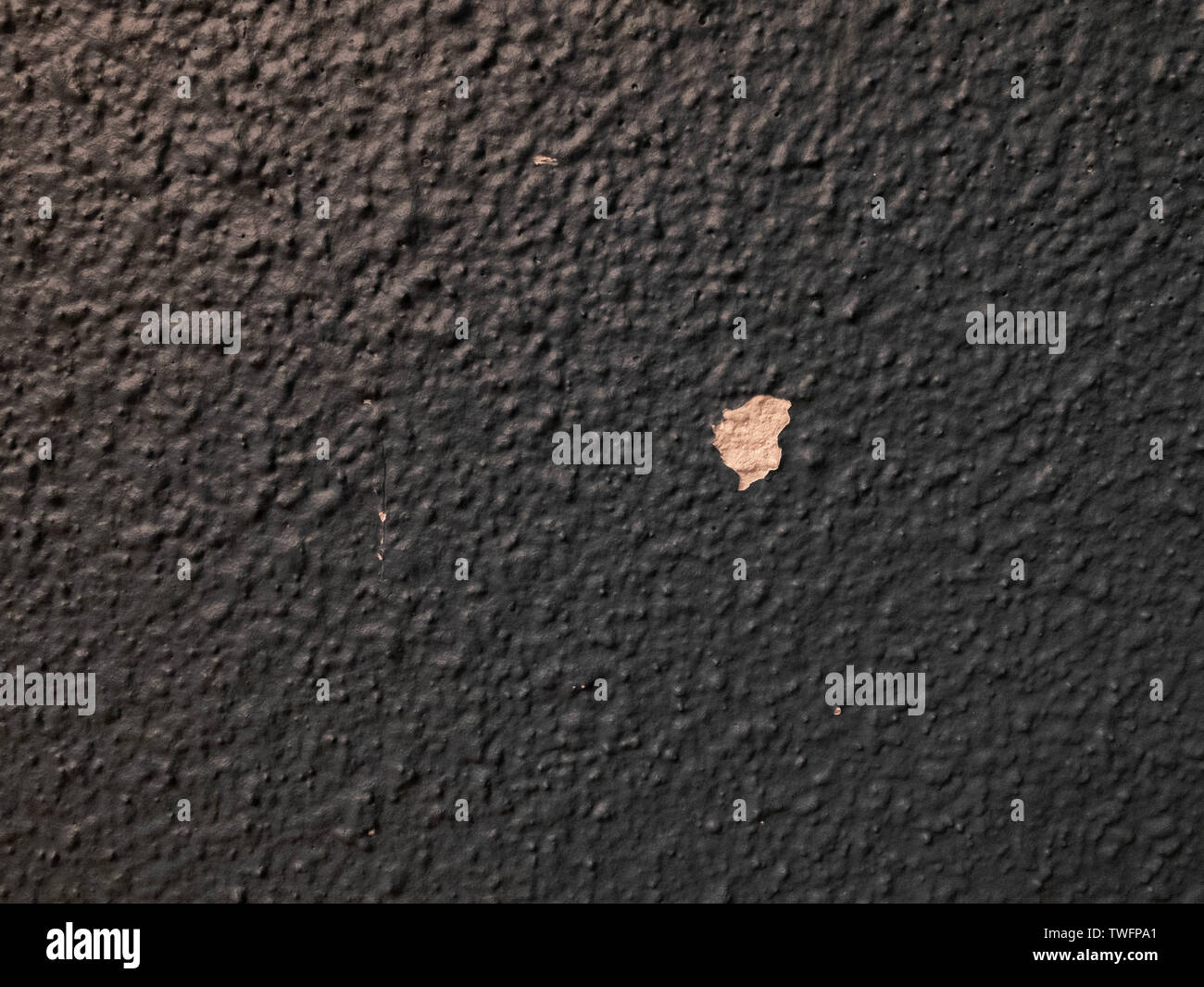 Black plastered textured wall with cracked missing spot Stock Photo - Alamy