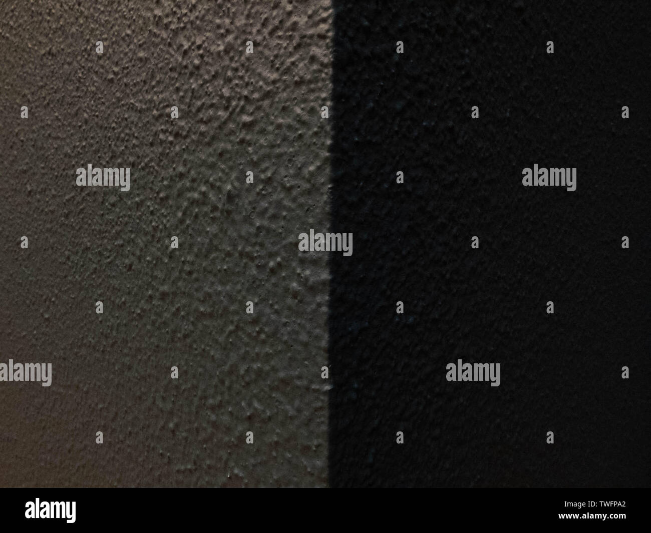 Black plastered textured wall. Light and shadow side Stock Photo - Alamy