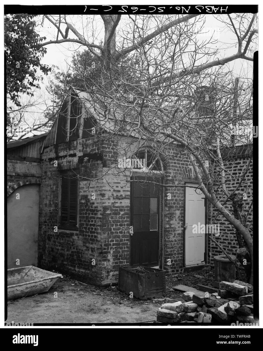 PRIVY This building is a reconstructed structure; the white door ...