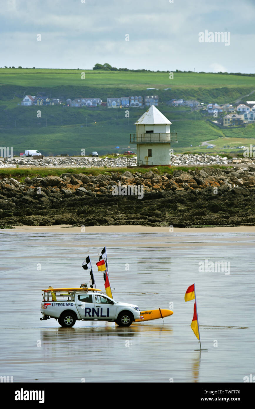 RNLI Lifeguard vehicle pictured on a deserted Coney Beach, Porthcawl ...