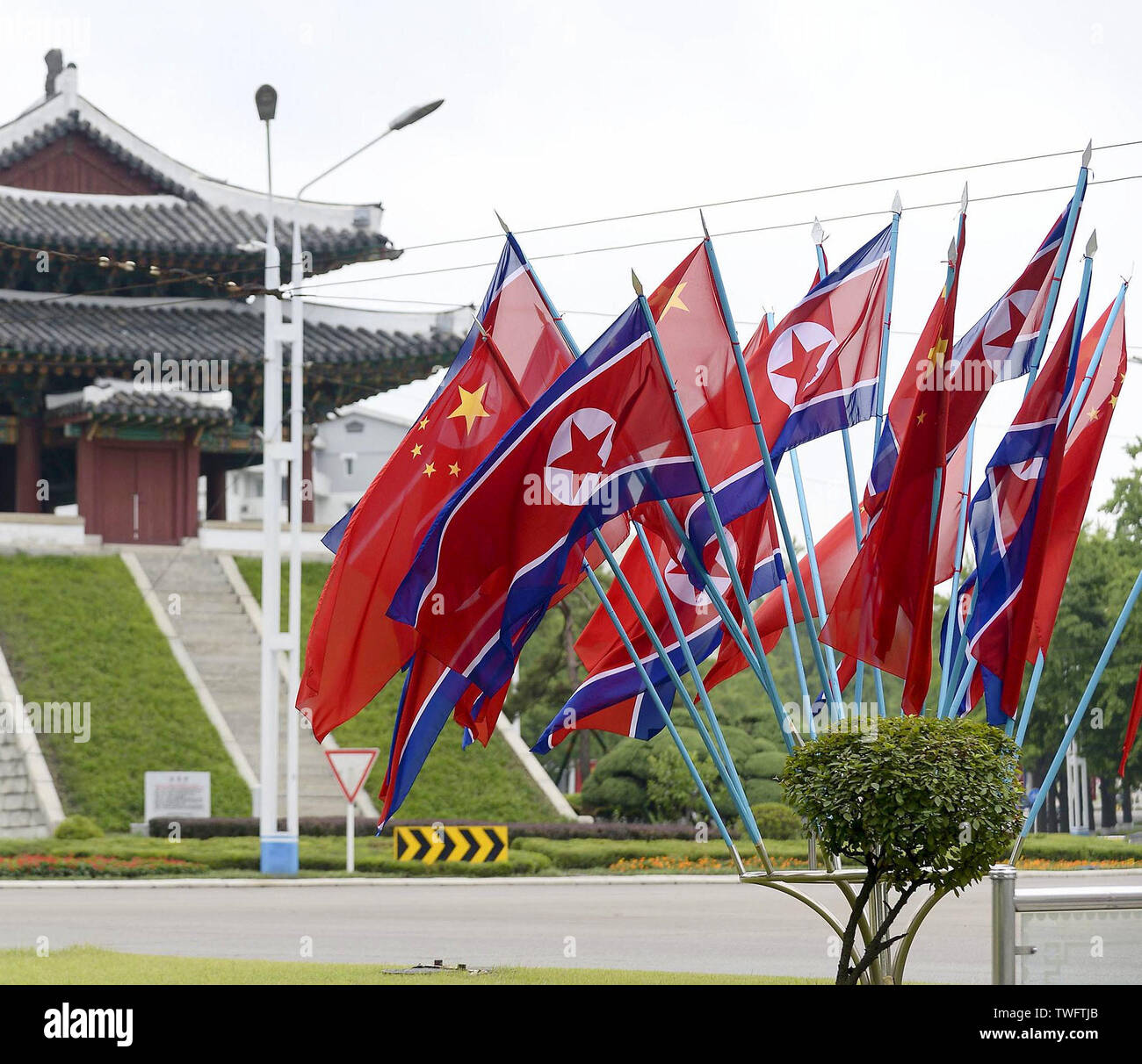 The national flags of China and North Korea are seen in Pyongyang on ...