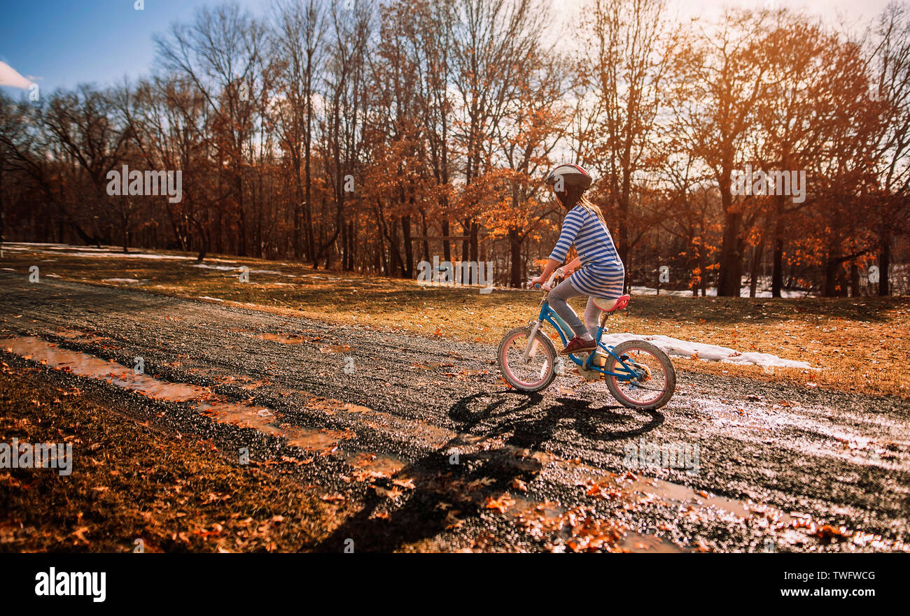 Girl riding a bicycle in the park, United States Stock Photo - Alamy