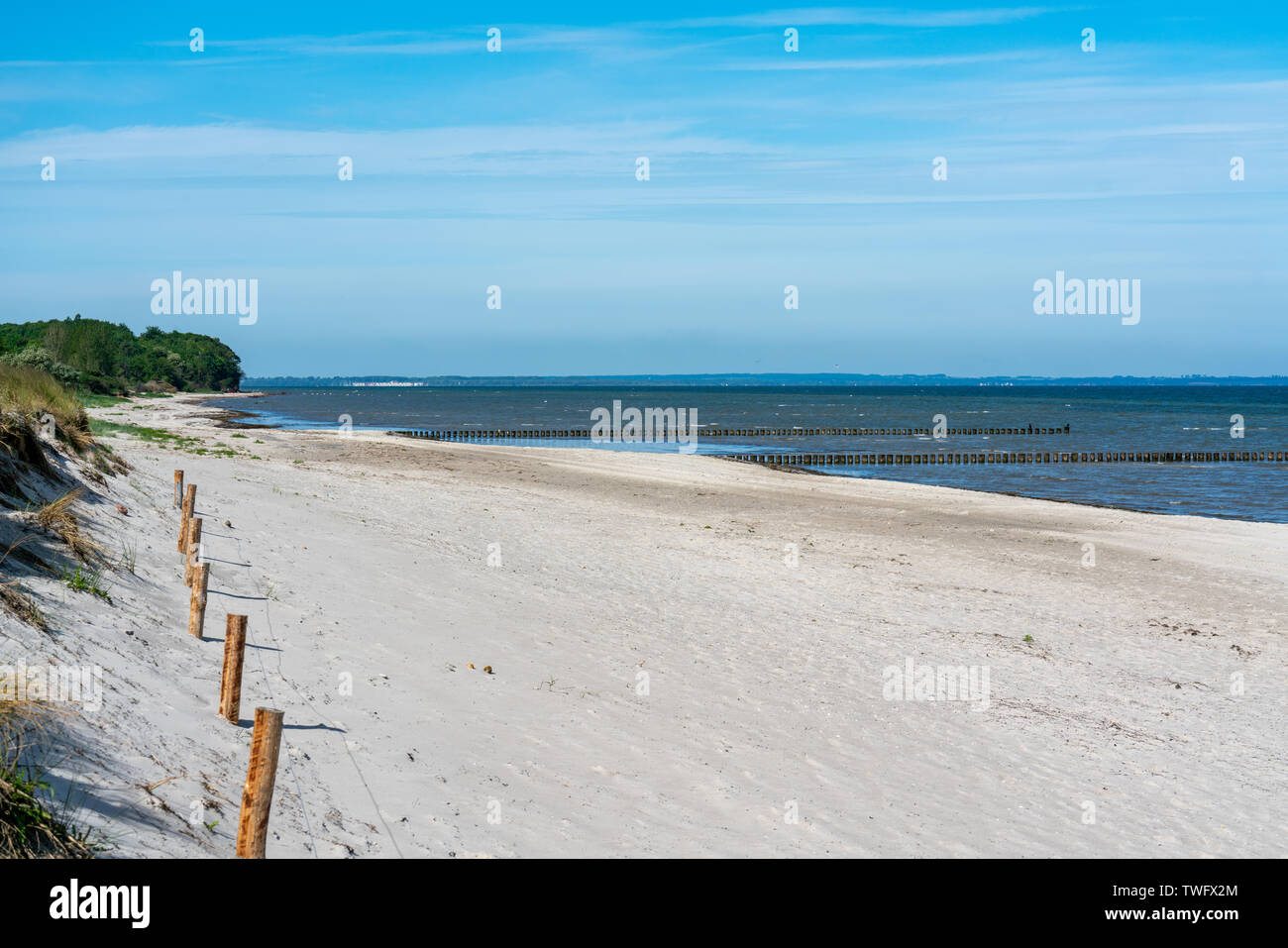 Dune landscape and beach on a bright summer day on the island Poel in ...