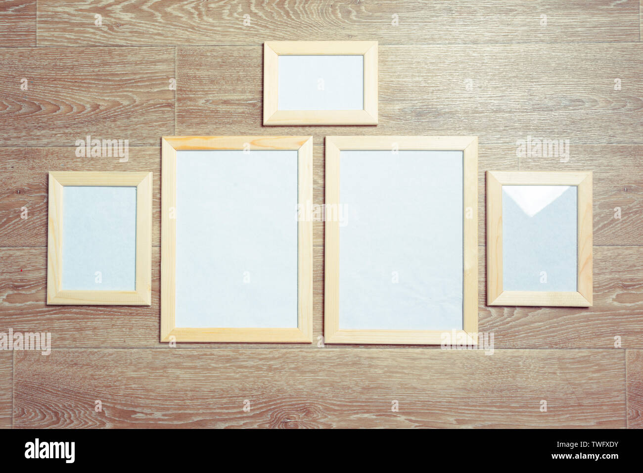 photo frames on the wooden wall Stock Photo - Alamy