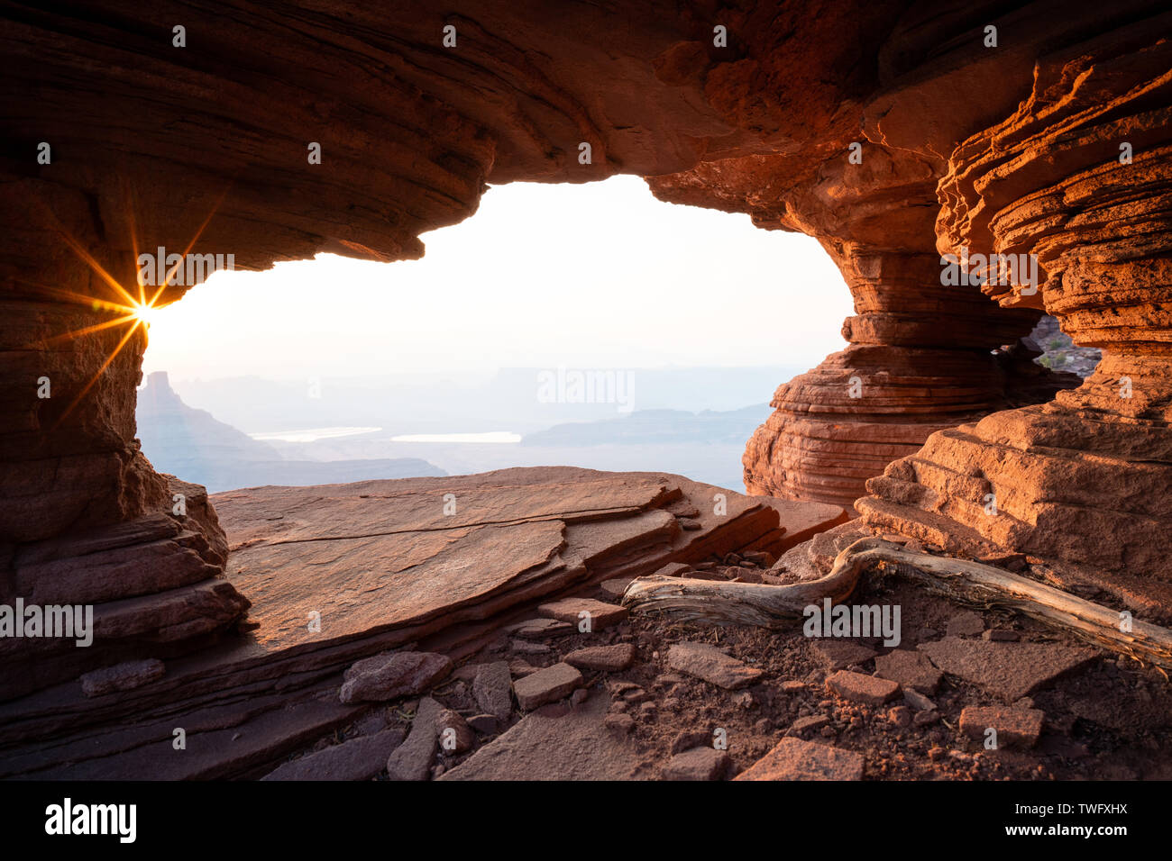 Sun Shining Through Window of a Small Desert Arch, Canyonlands National ...