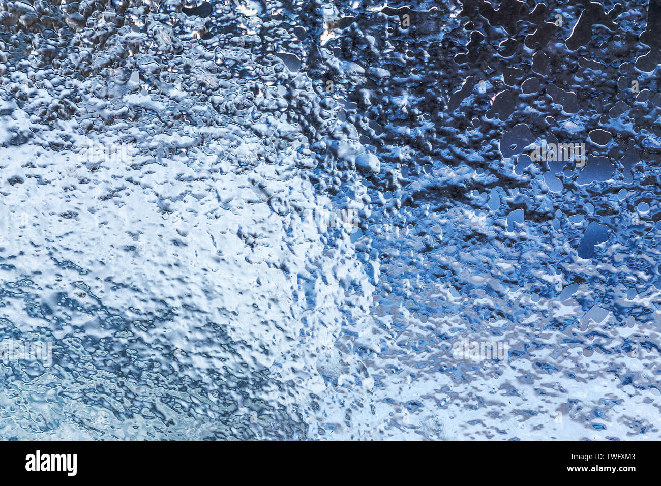 Frozen ice pattern on glass Stock Photo - Alamy