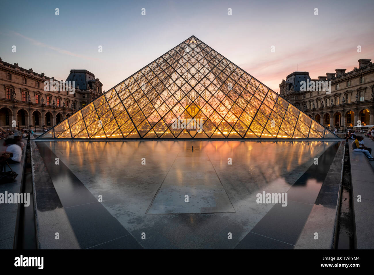 The Louvre Pyramid at sunset Stock Photo - Alamy