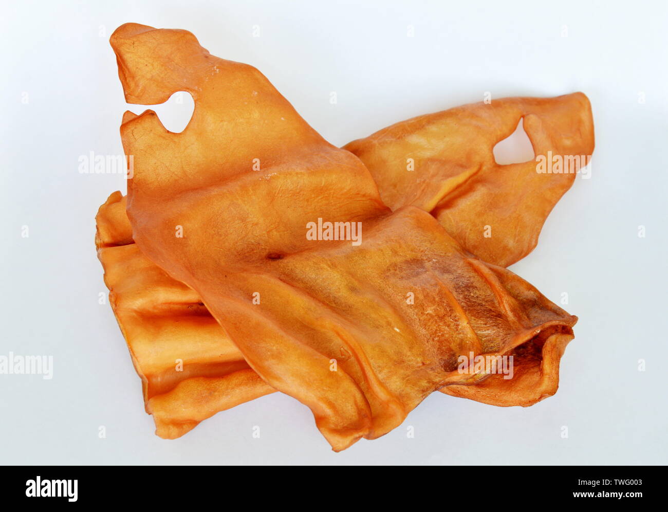 dried cow ear on white background Stock Photo - Alamy