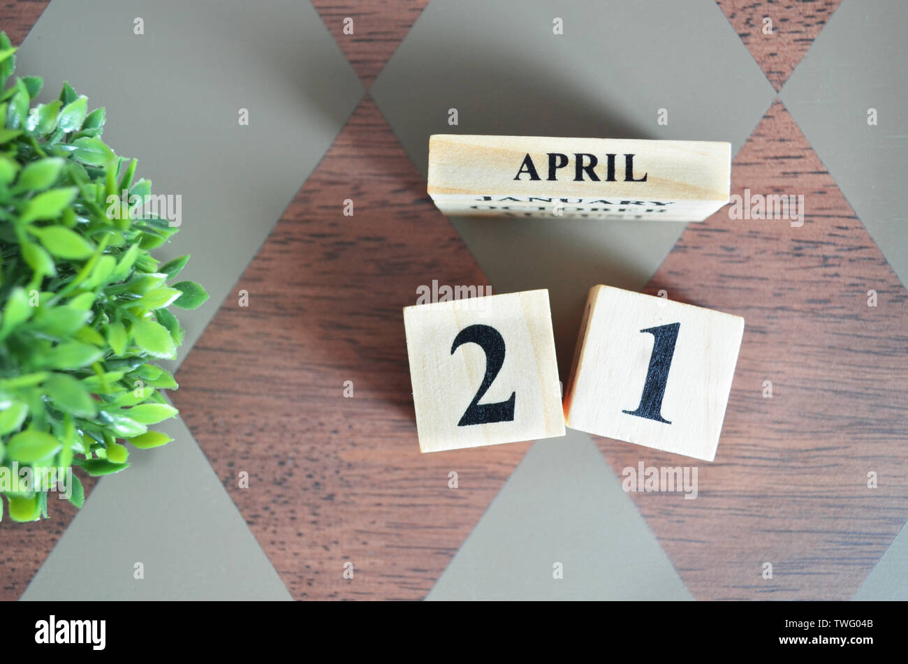 Date of April with leaf on diamond pattern table for background Stock ...