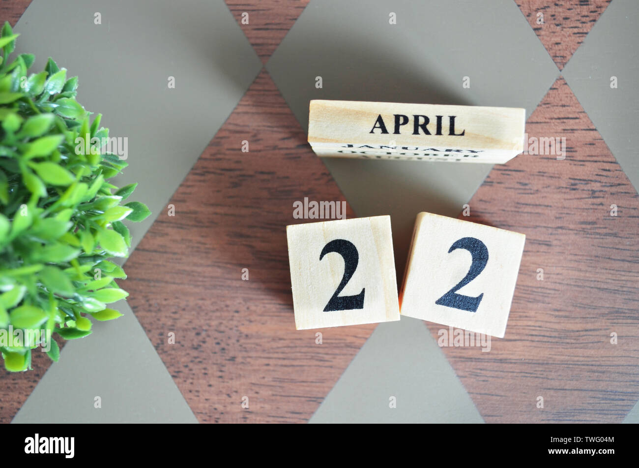Date of April with leaf on diamond pattern table for background Stock ...