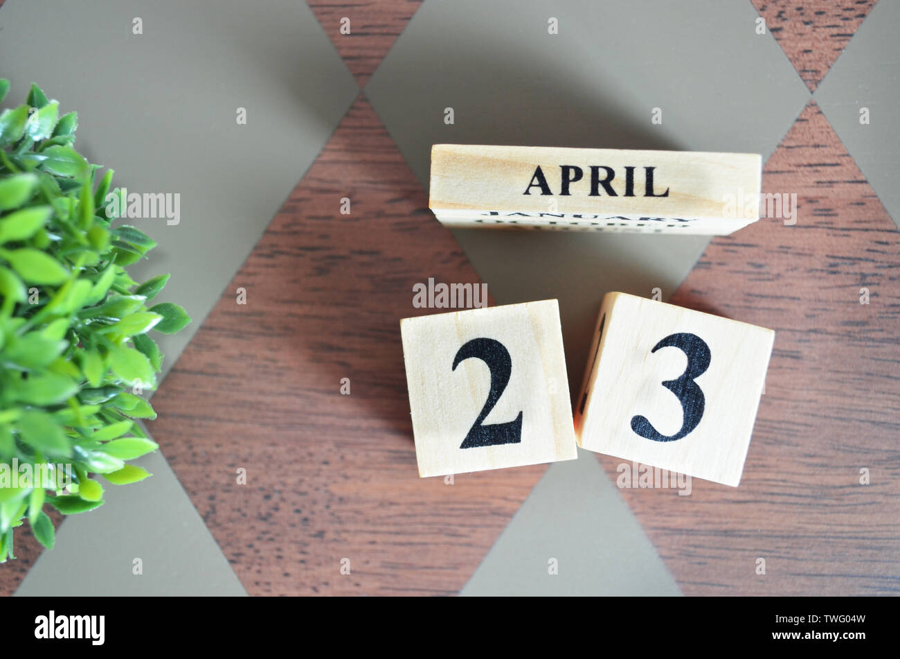 Date of April with leaf on diamond pattern table for background Stock ...