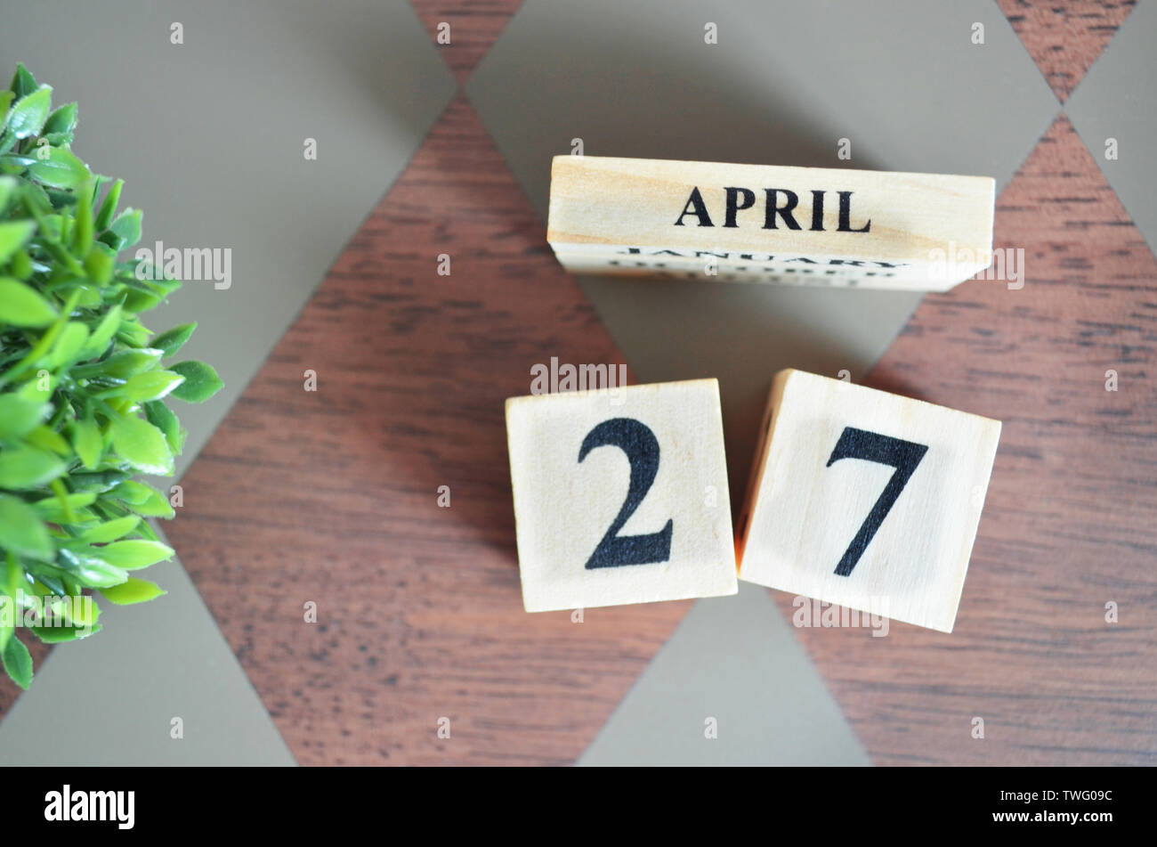 Date of April with leaf on diamond pattern table for background Stock ...