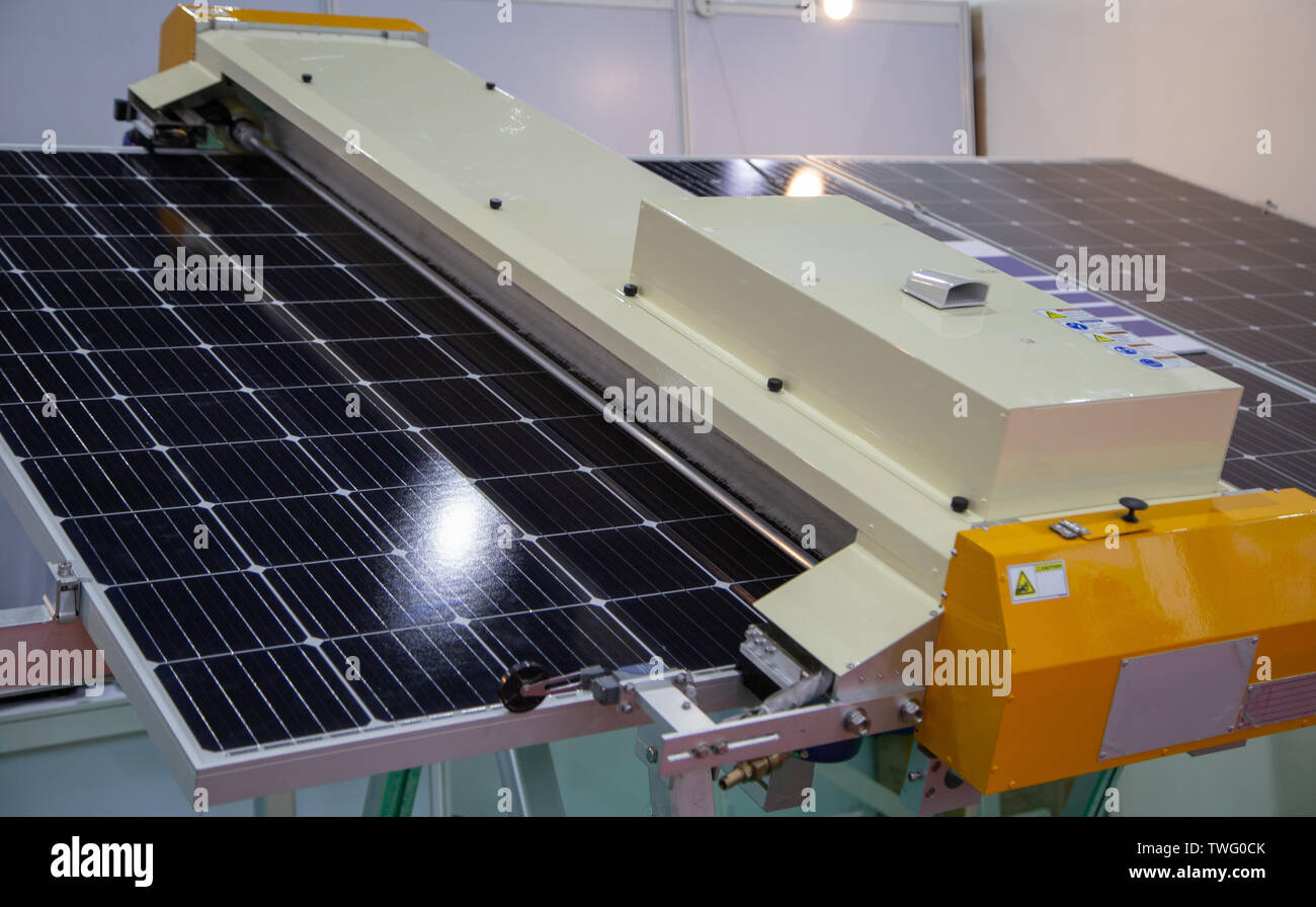 Automatic solar cell panels cleaning robot machine Stock Photo - Alamy