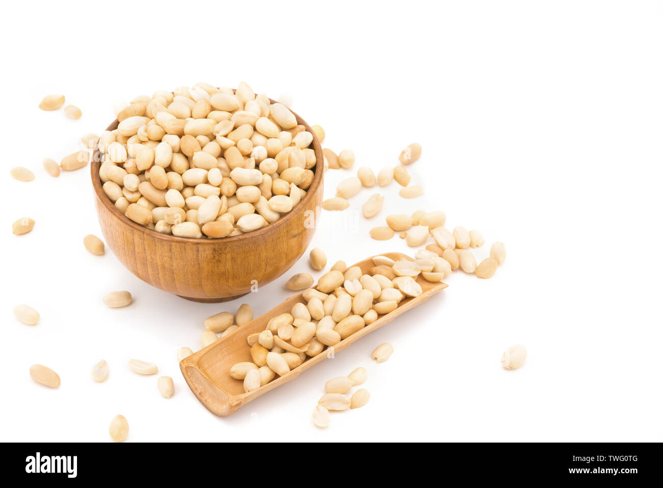 Peeling peanuts on white background Stock Photo - Alamy