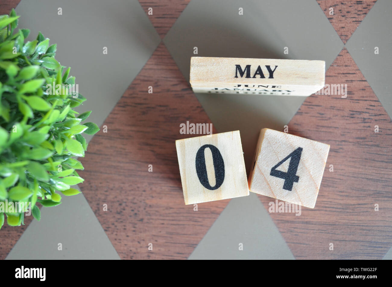 Date of May with leaf on diamond pattern table for background Stock ...